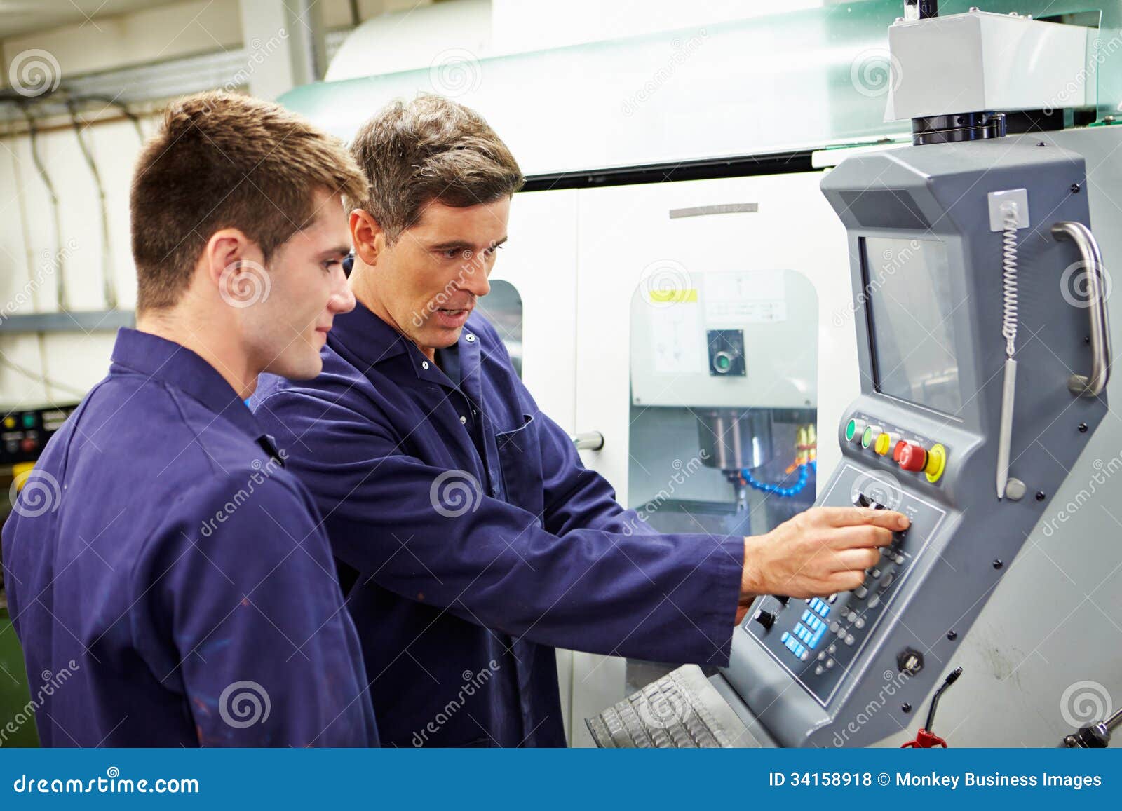Engineer and Apprentice Using Automated Milling Machine Stock Photo ...