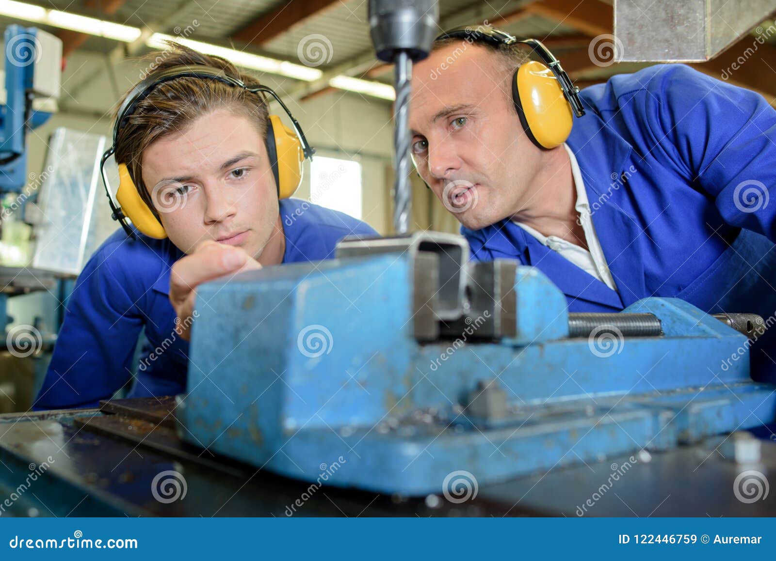 Engineer with Apprentice Using Bench Drill Stock Image - Image of ...