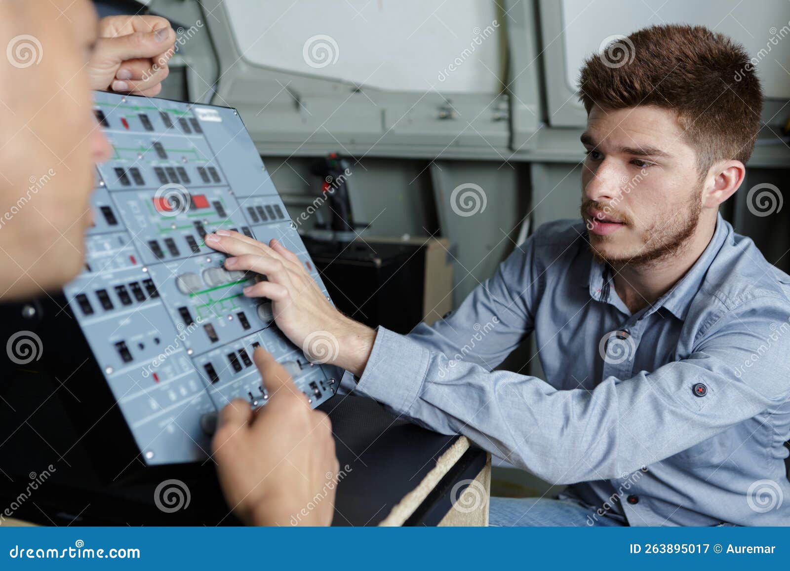 Engineer and Apprentice Using Computerized Cutting Machine Stock Image ...