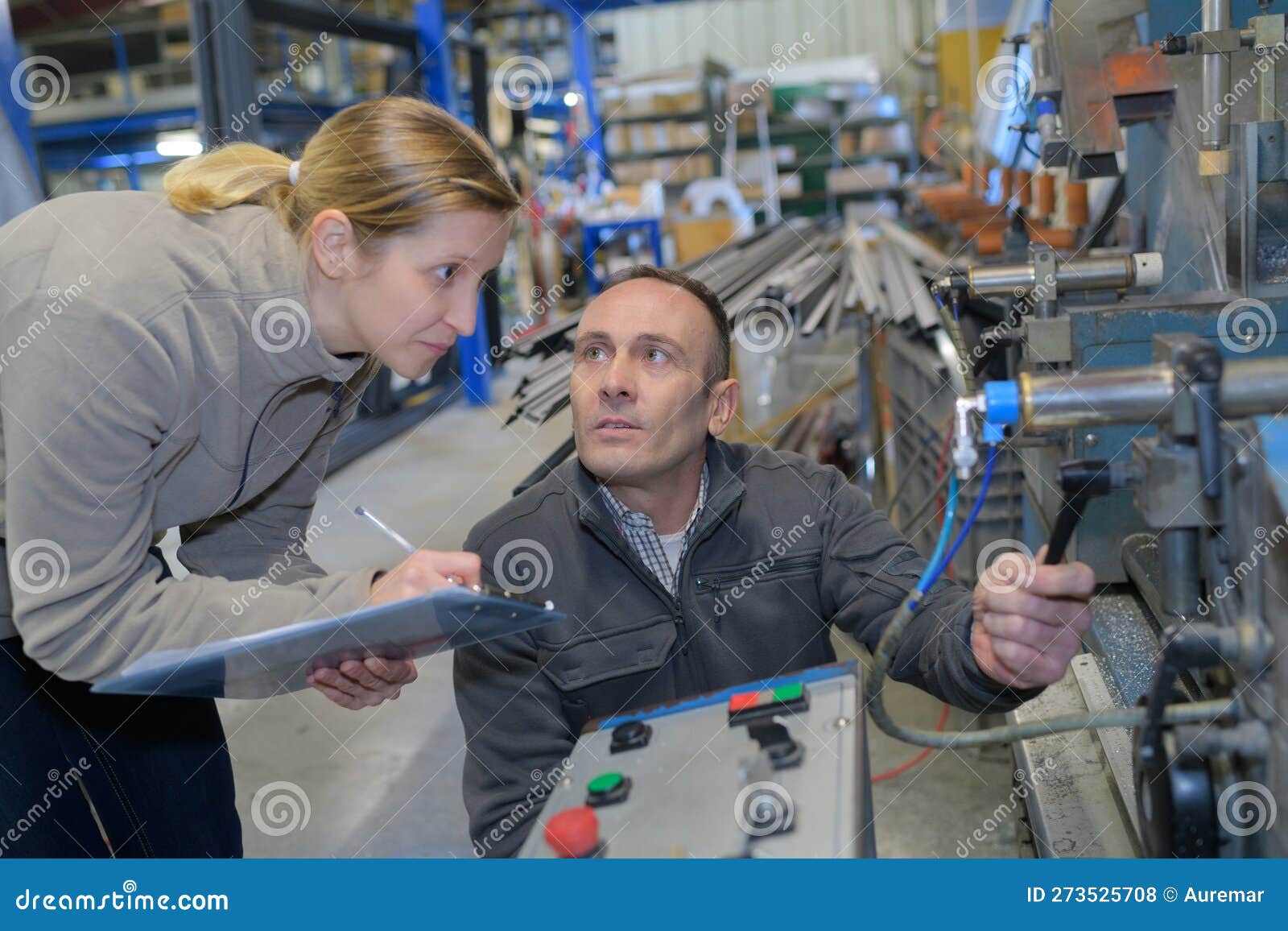 Engineer and Apprentice Working on Machine in Factory Stock Photo ...