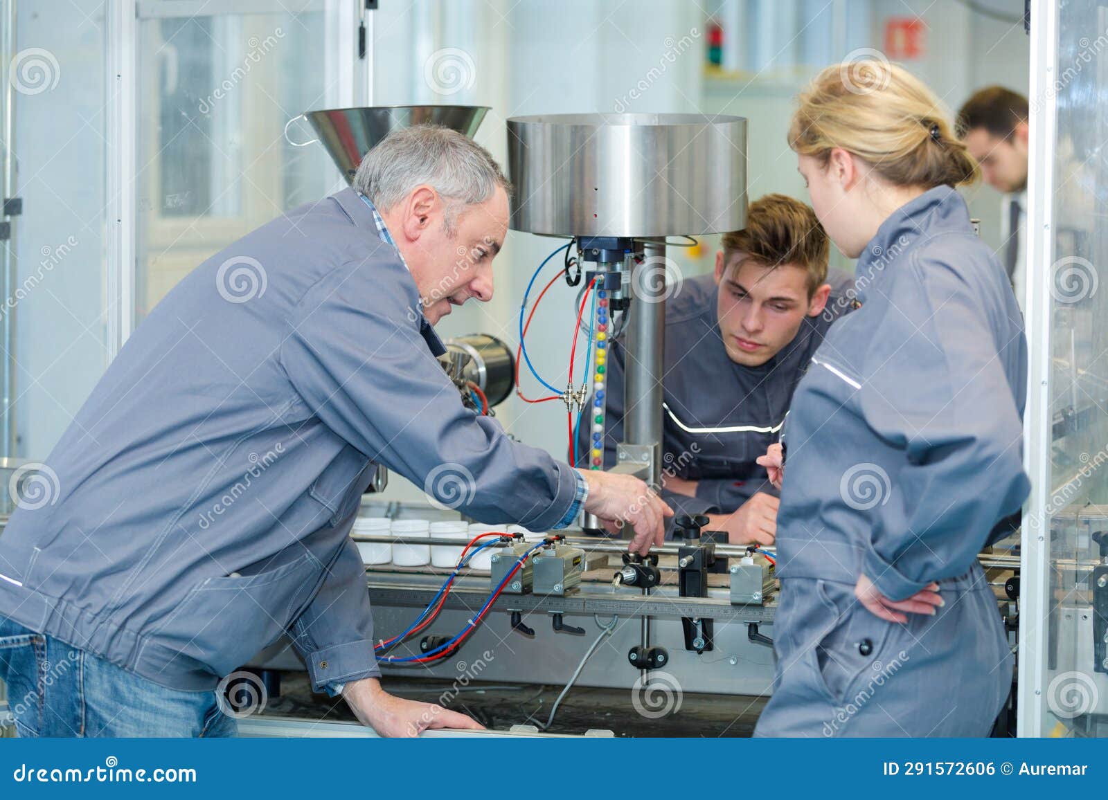 Engineer and Apprentices Using Automated Milling Machine Stock Photo ...