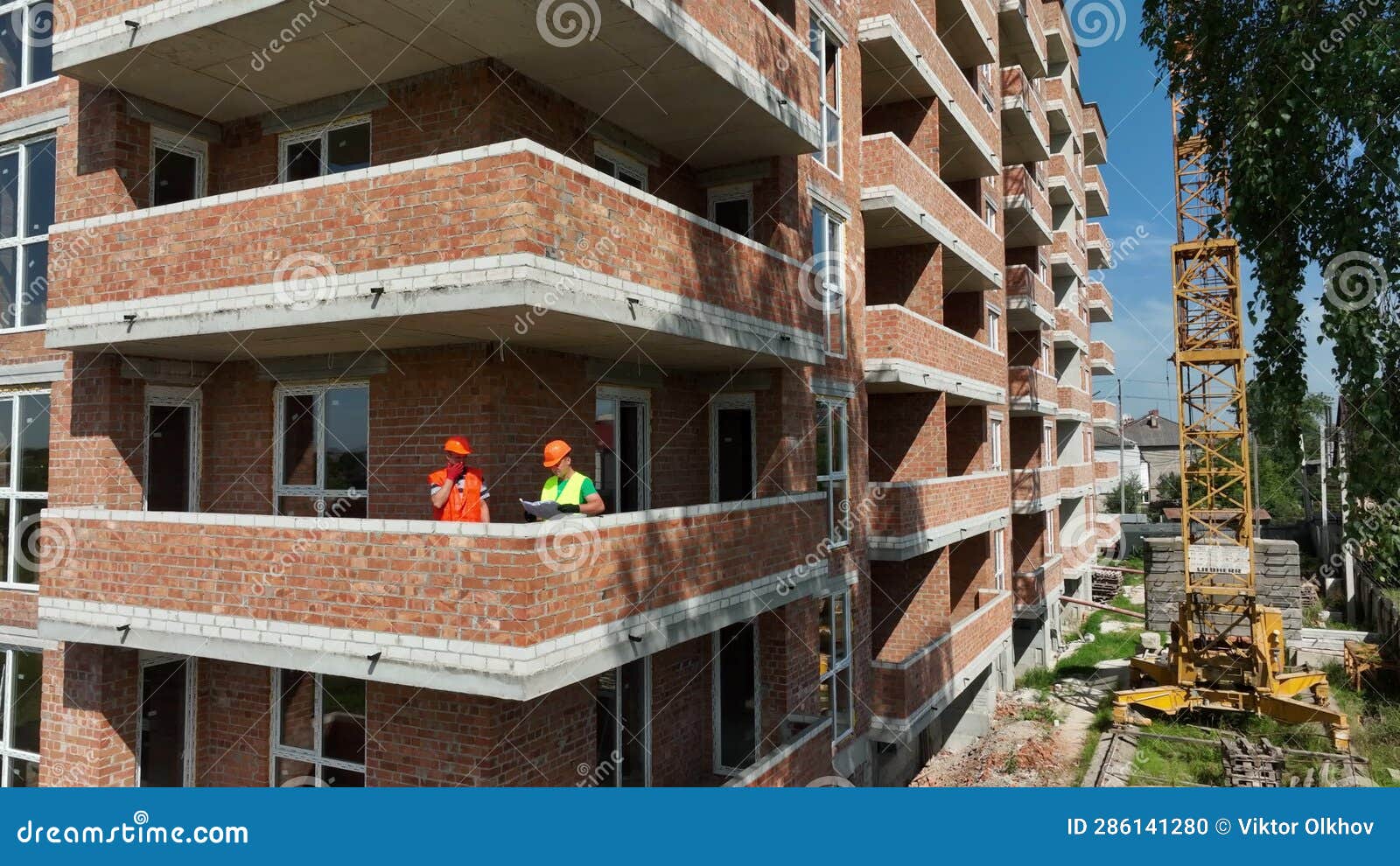 An Engineer and an Architect Consider the Plan of Construction and ...