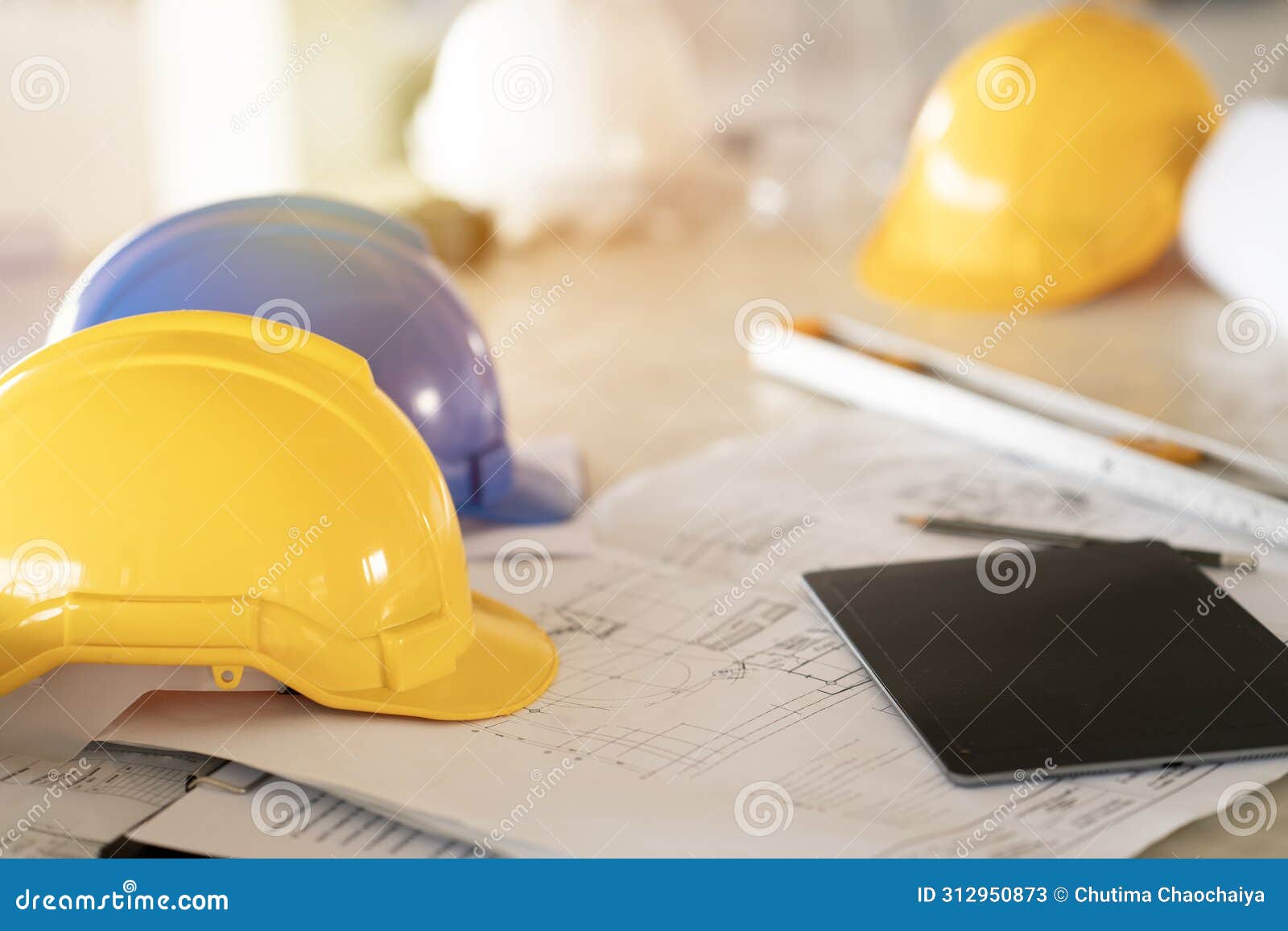 Engineer or Architect Desk with Helmet and Blur Blueprint Background in ...