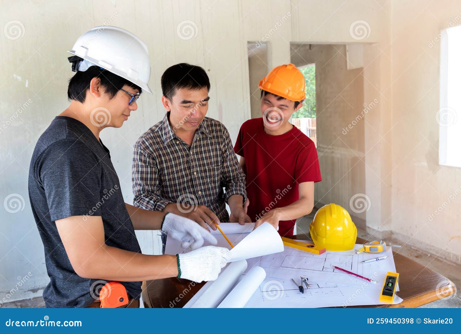Engineer and Architect Discussing with Foreman about Project in ...