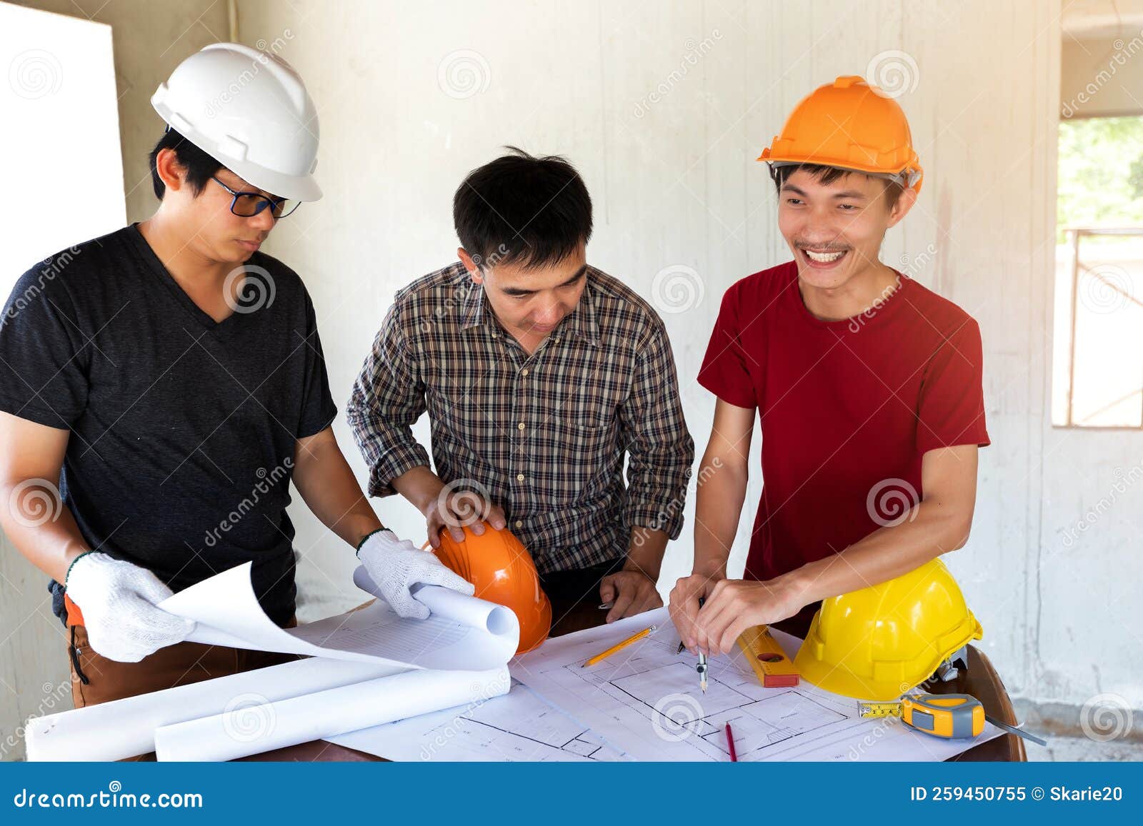 Engineer and Architect Discussing with Foreman about Project in ...