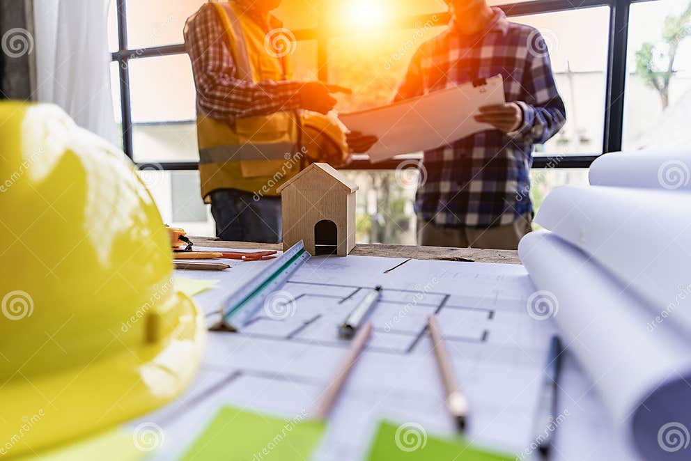 Engineer and Architect Discussing New Project on Building Site ...