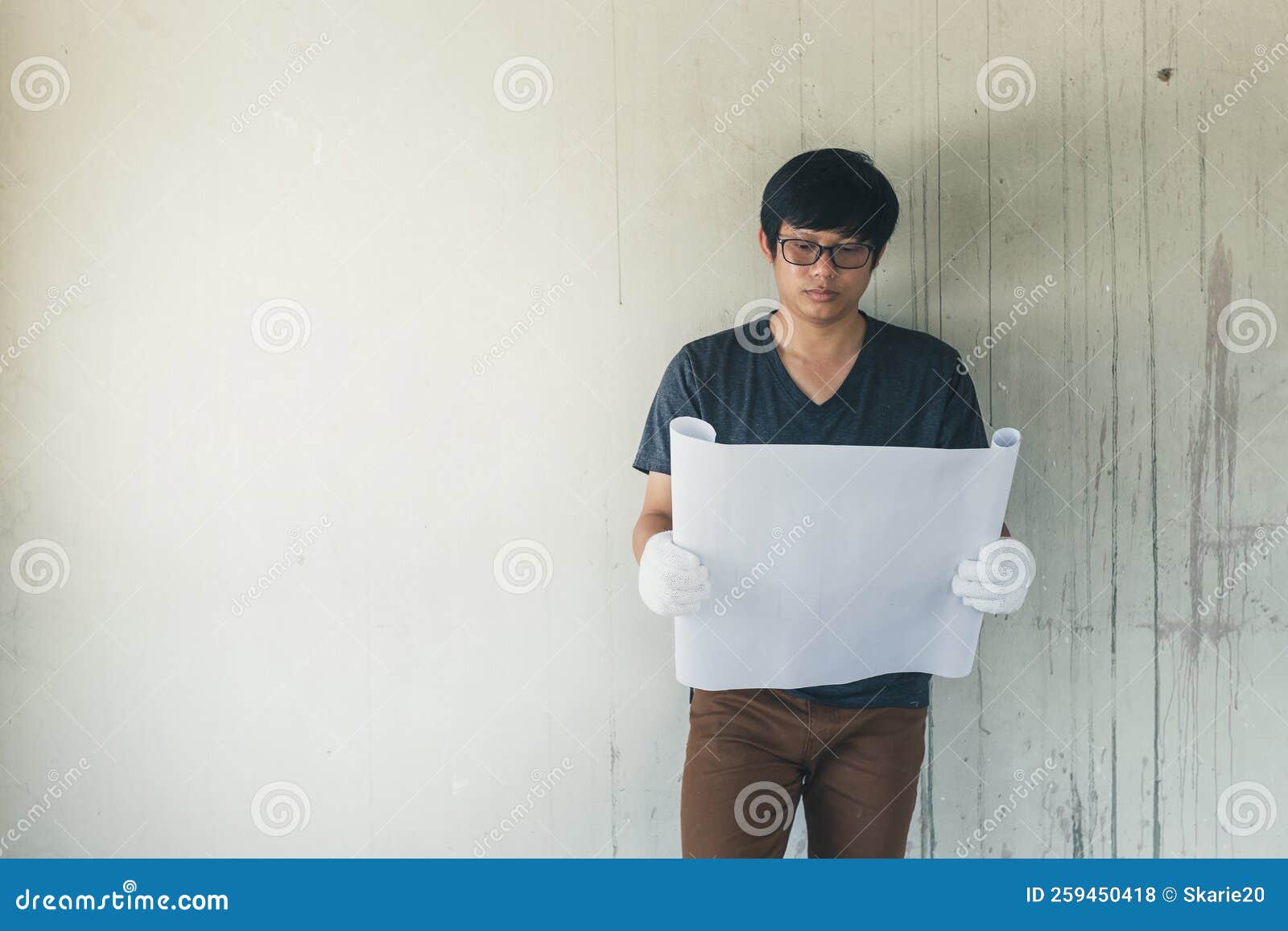 Engineer or Architect Holding Blueprint in Building Construction Site ...