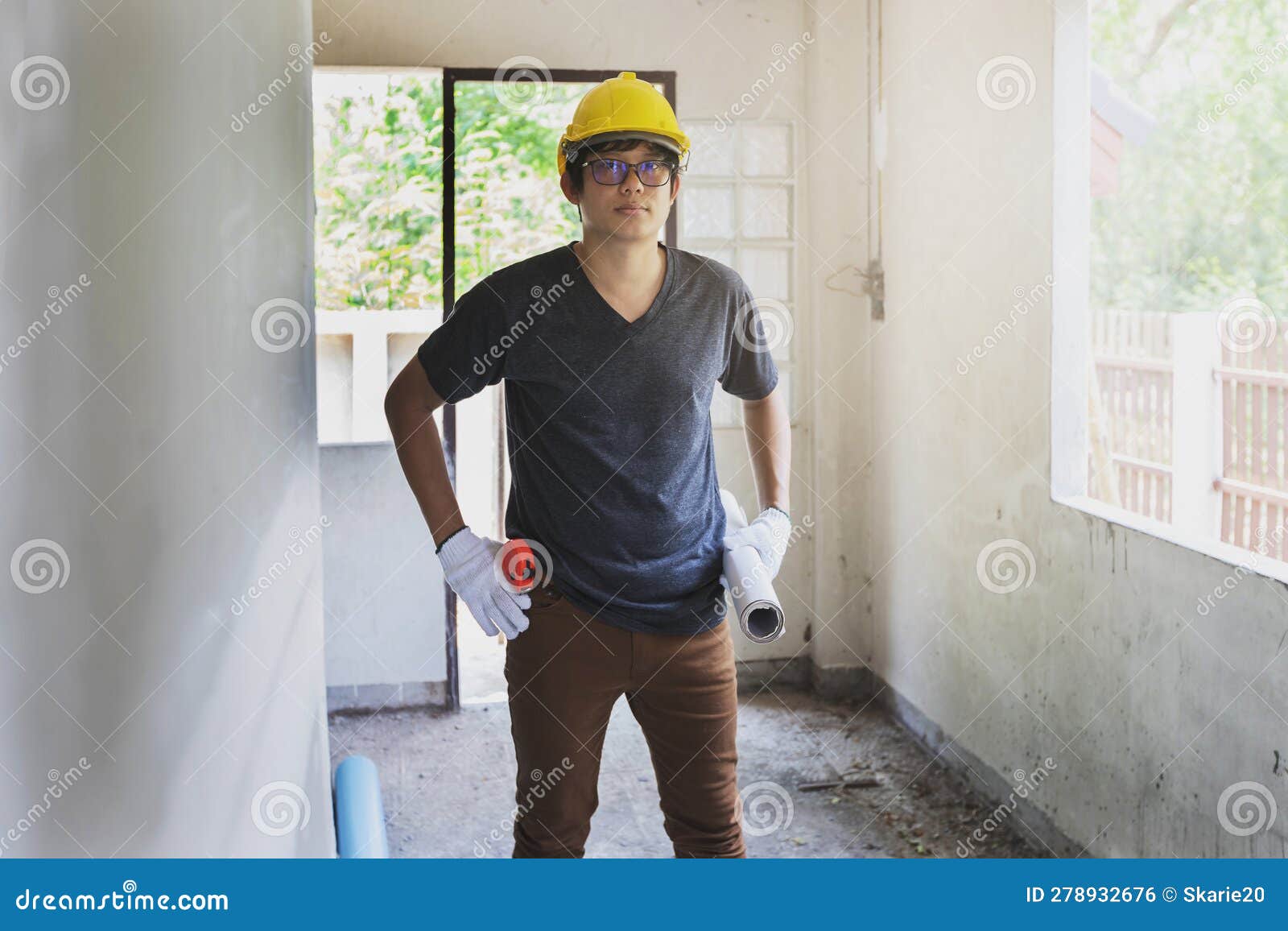 Engineer or Architect Holding Blueprint and Helmet in Building ...