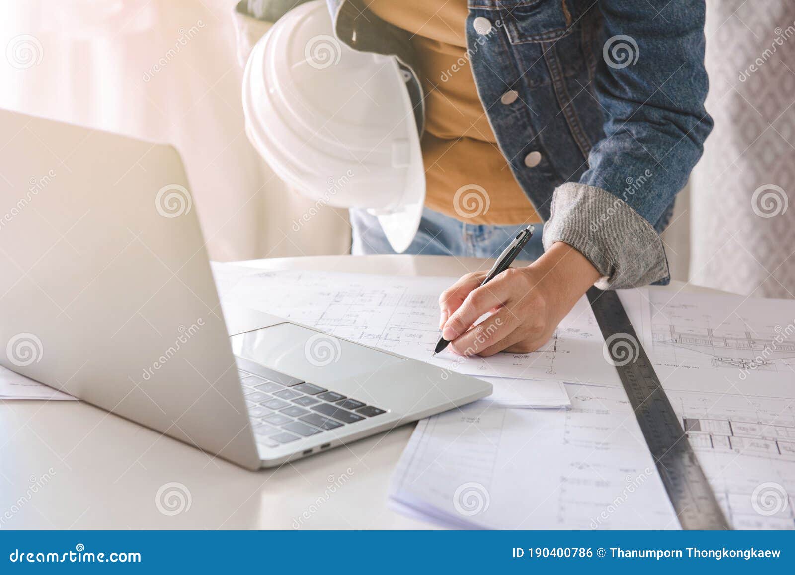 Engineer or Architect Holding Pen with Drawings in Construction on ...