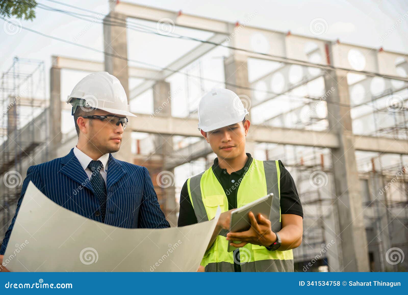 Engineer and Architect Monitor the Progress of Building Construction ...