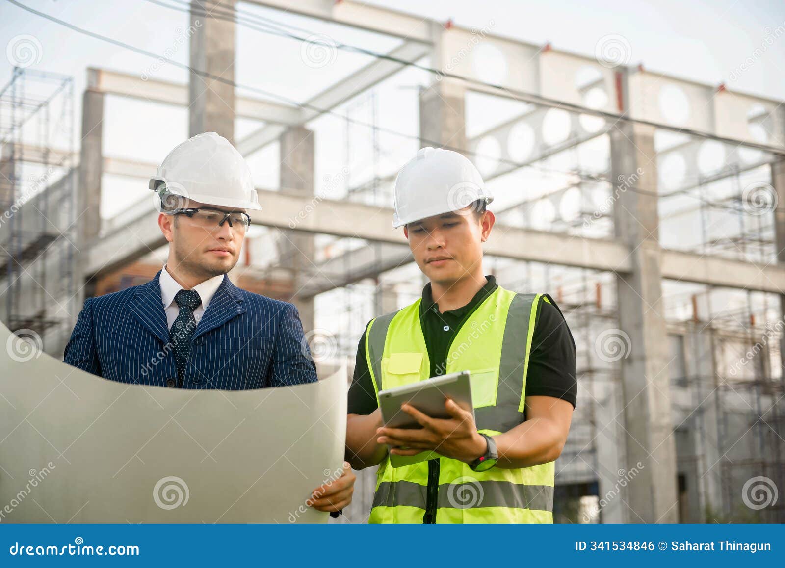 Engineer and Architect Monitor the Progress of Building Construction ...