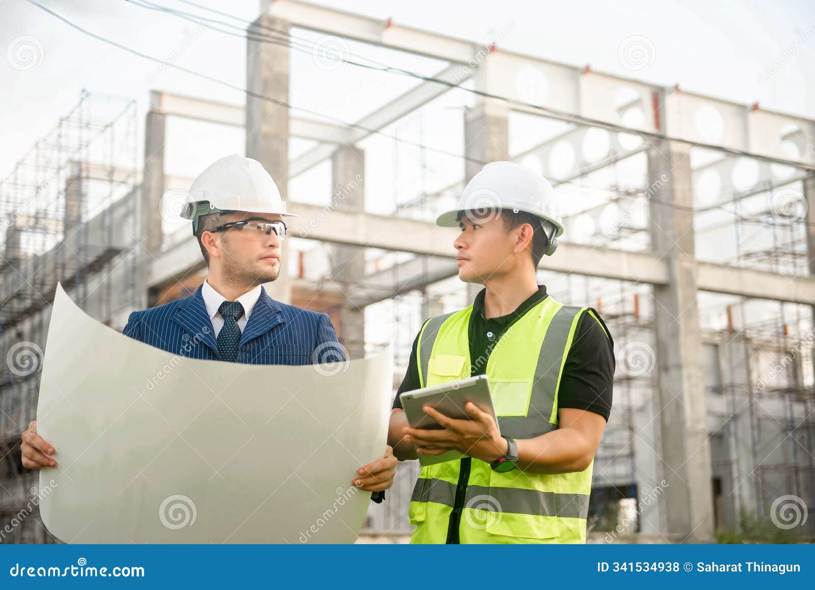 Engineer and Architect Monitor the Progress of Building Construction ...