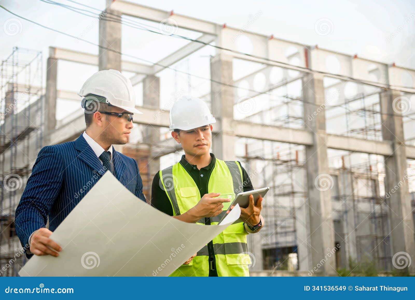 Engineer and Architect Monitor the Progress of Building Construction ...
