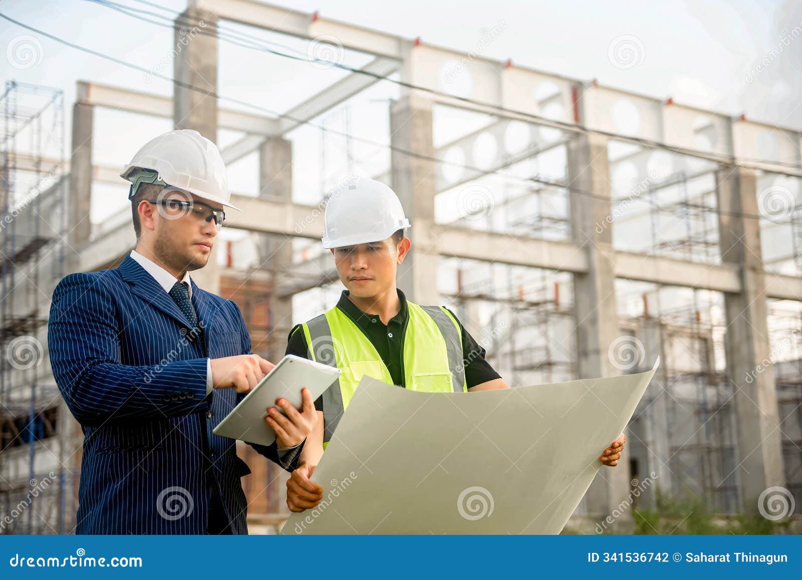 Engineer and Architect Monitor the Progress of Building Construction ...