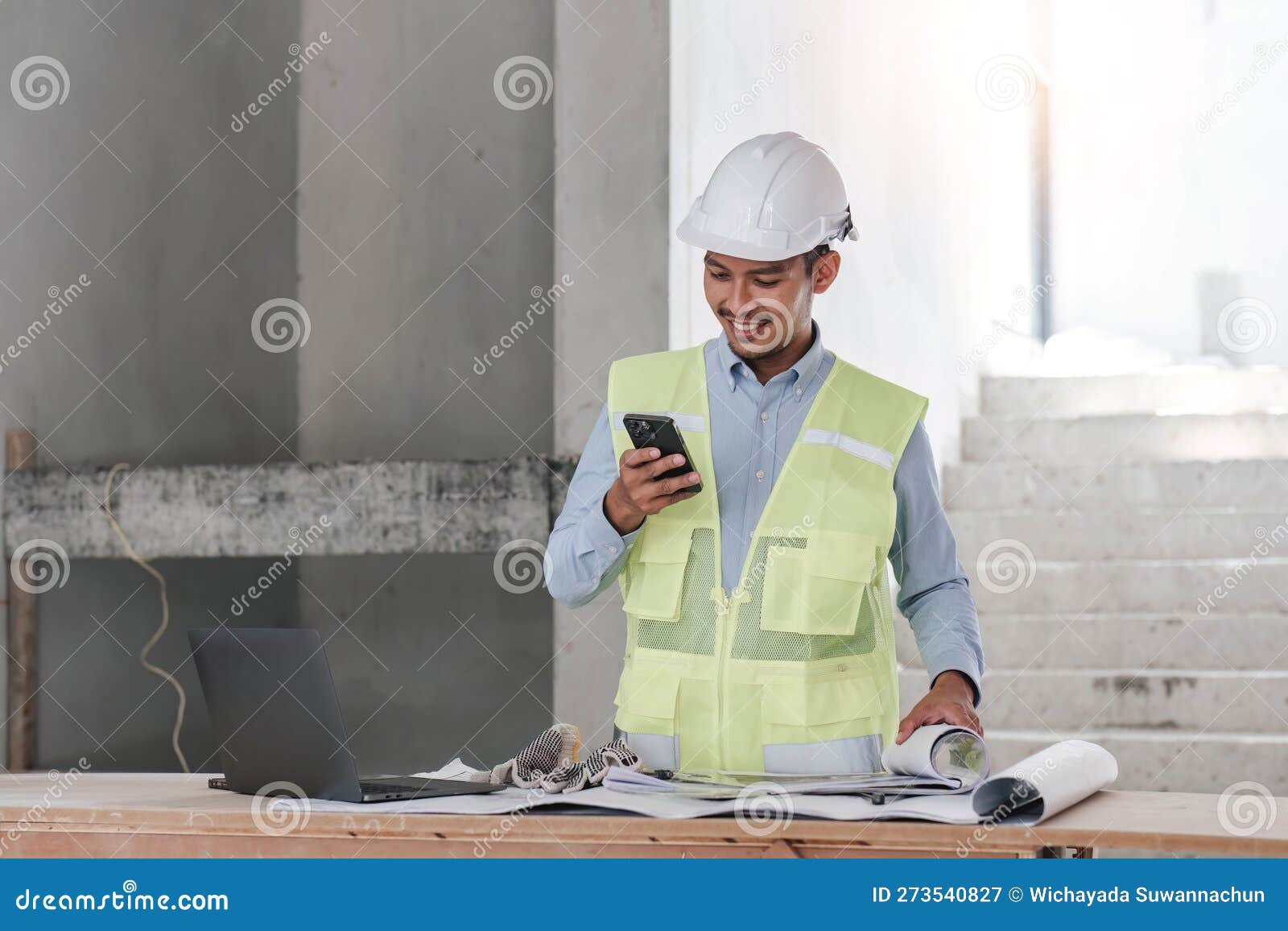 Engineer or Architect with Protective Safety Helmet Checking Using ...