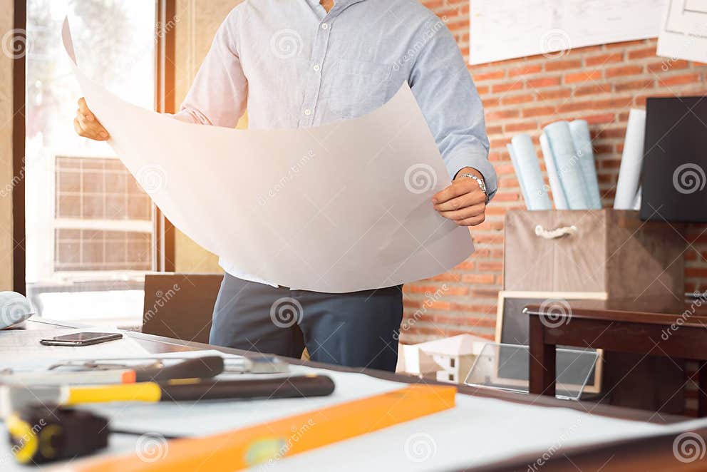 Engineer or Architect is Reading Paper Blueprint Project Plan. Civil ...