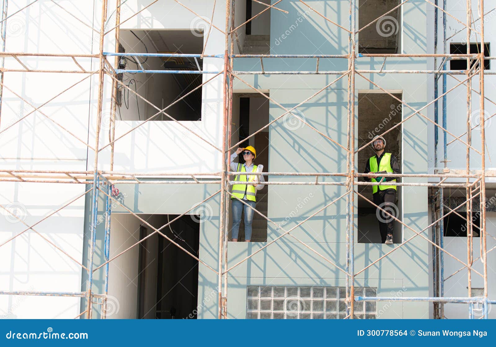 Engineer and Architect Working on the Construction Site, Double ...