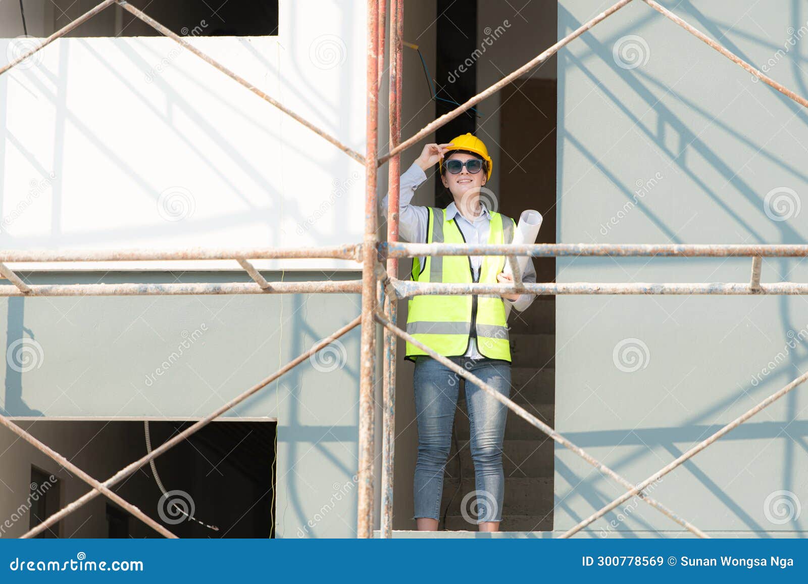 Engineer or Architect Working on the Construction Site, Double-checking ...