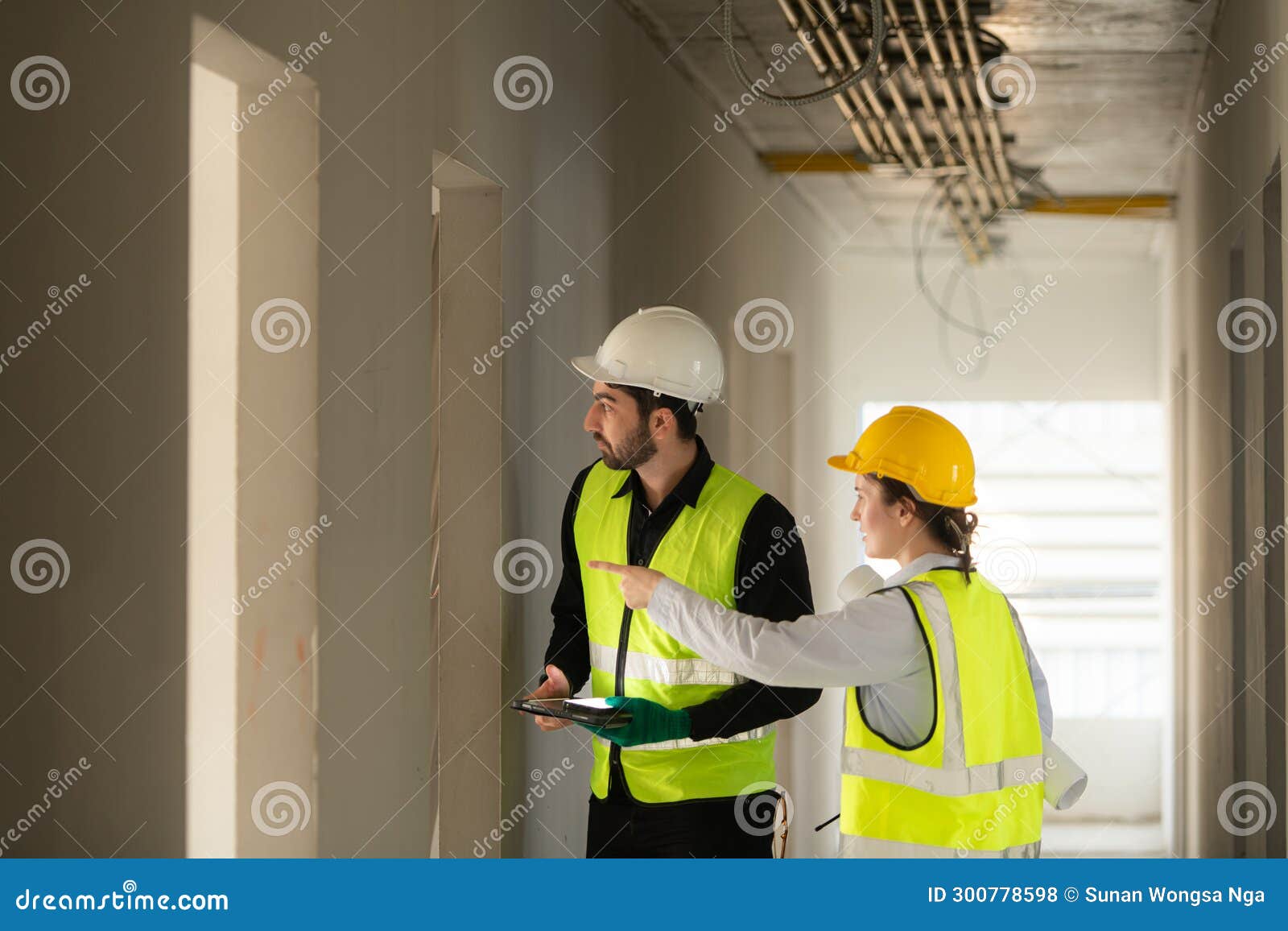 Engineer and Architect Working on the Construction Site, Double ...