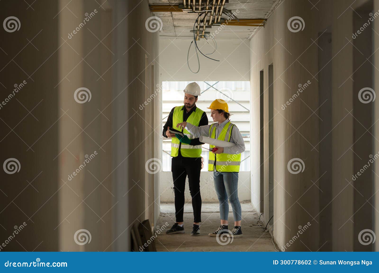 Engineer and Architect Working on the Construction Site, Double ...