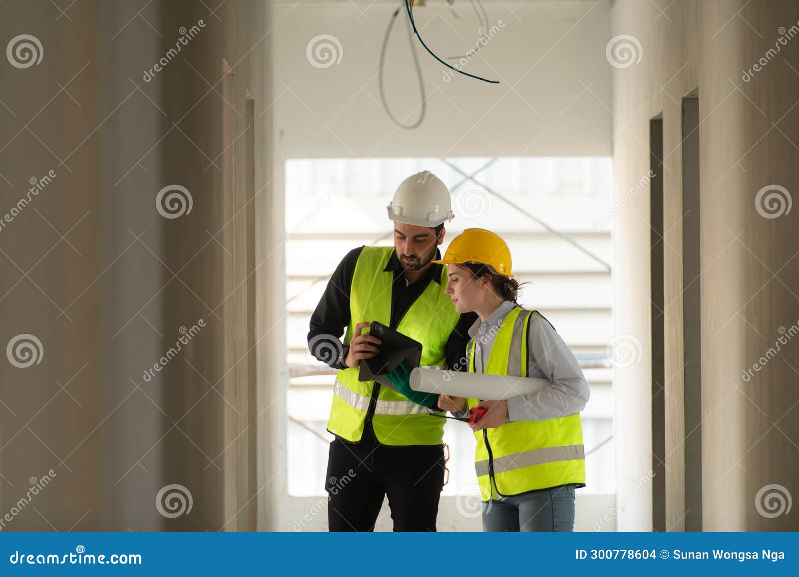Engineer and Architect Working on the Construction Site, Double ...
