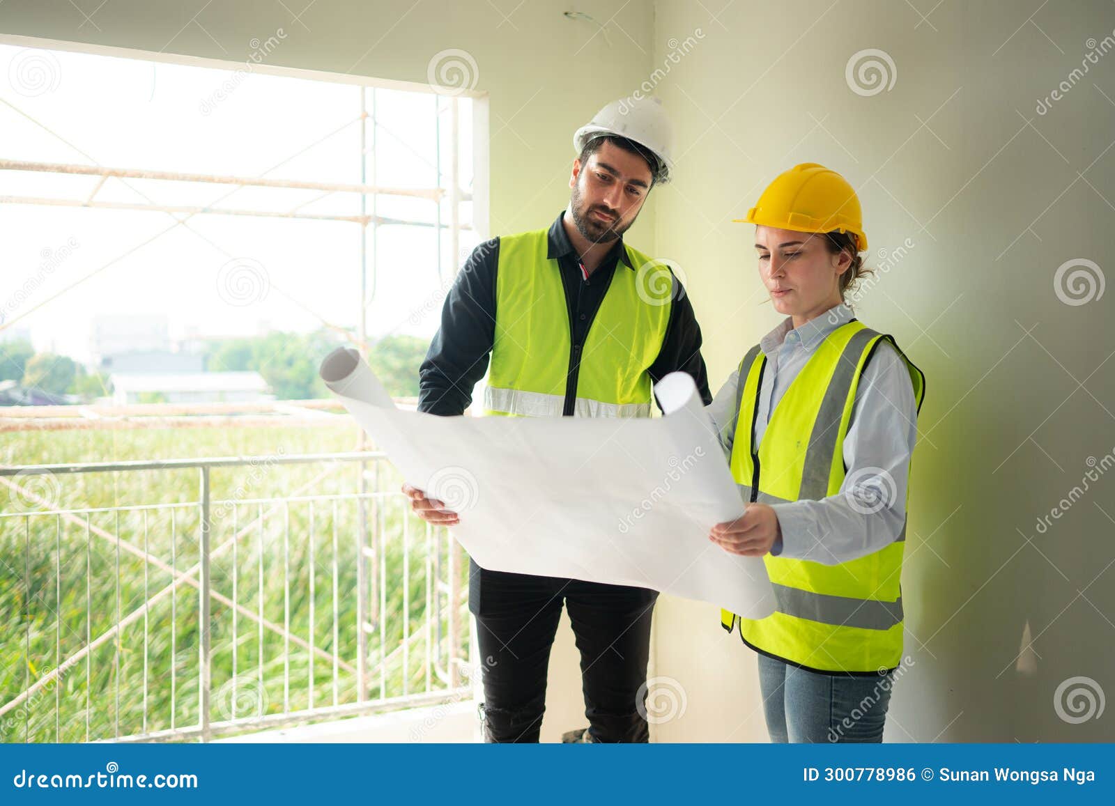 Engineer and Architect Working on the Construction Site, Double ...