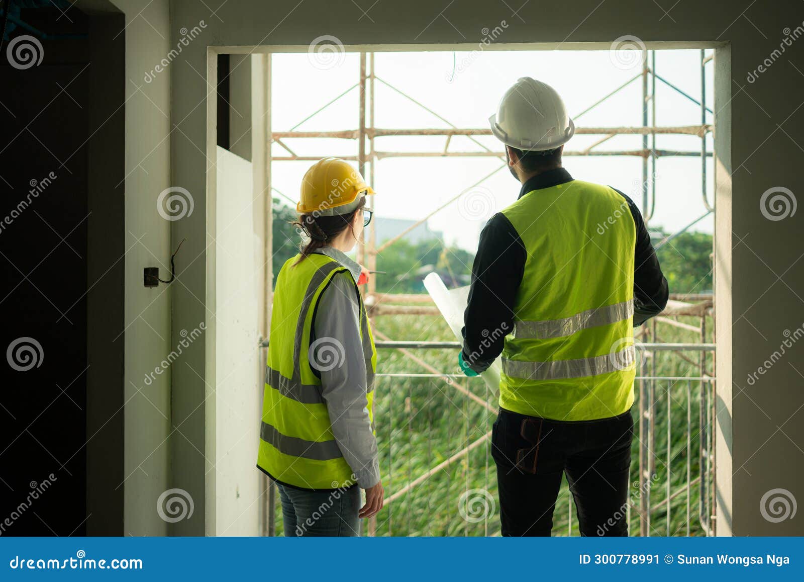 Engineer and Architect Working on the Construction Site, Double ...
