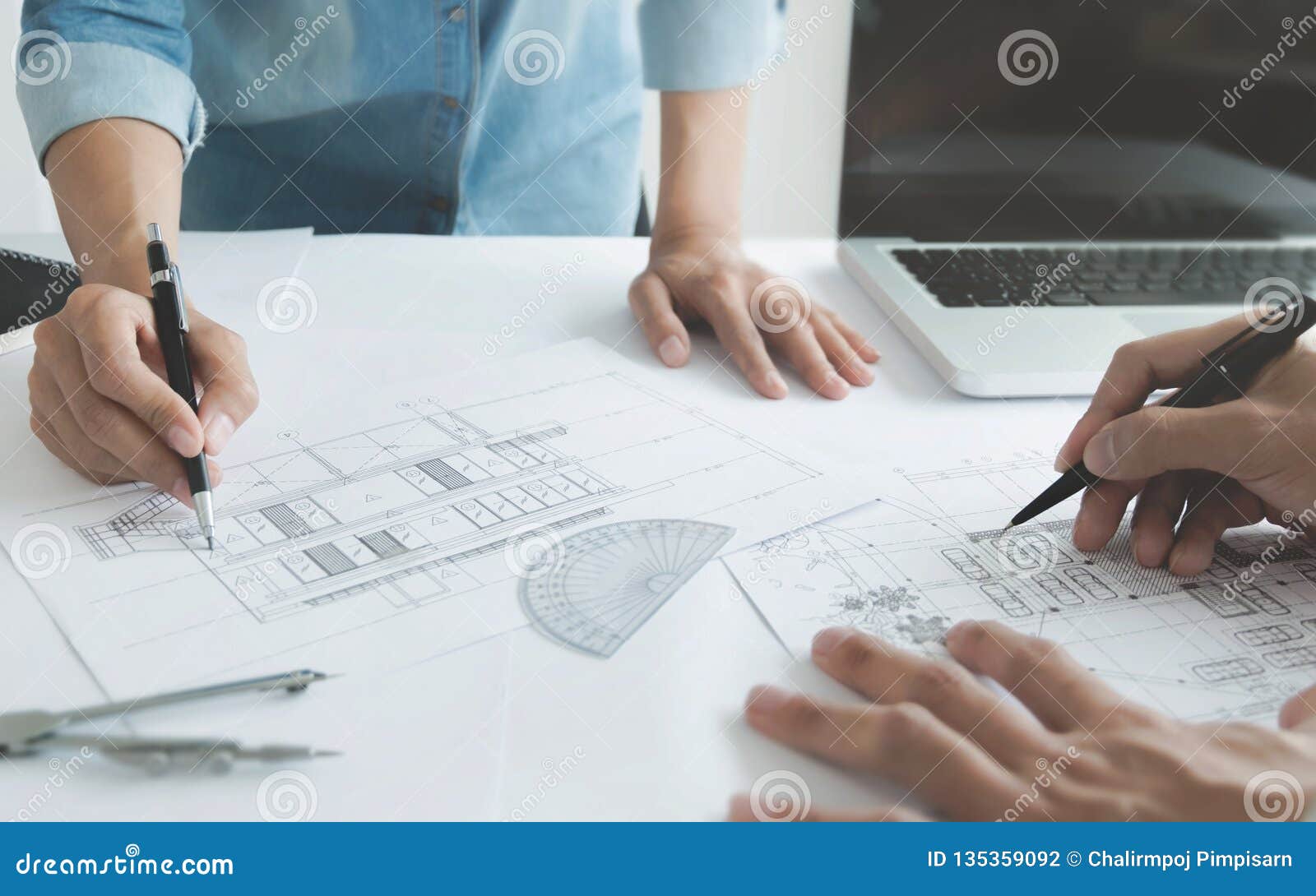 Engineer Architects Discussing on the Table with Blueprint Stock Photo ...