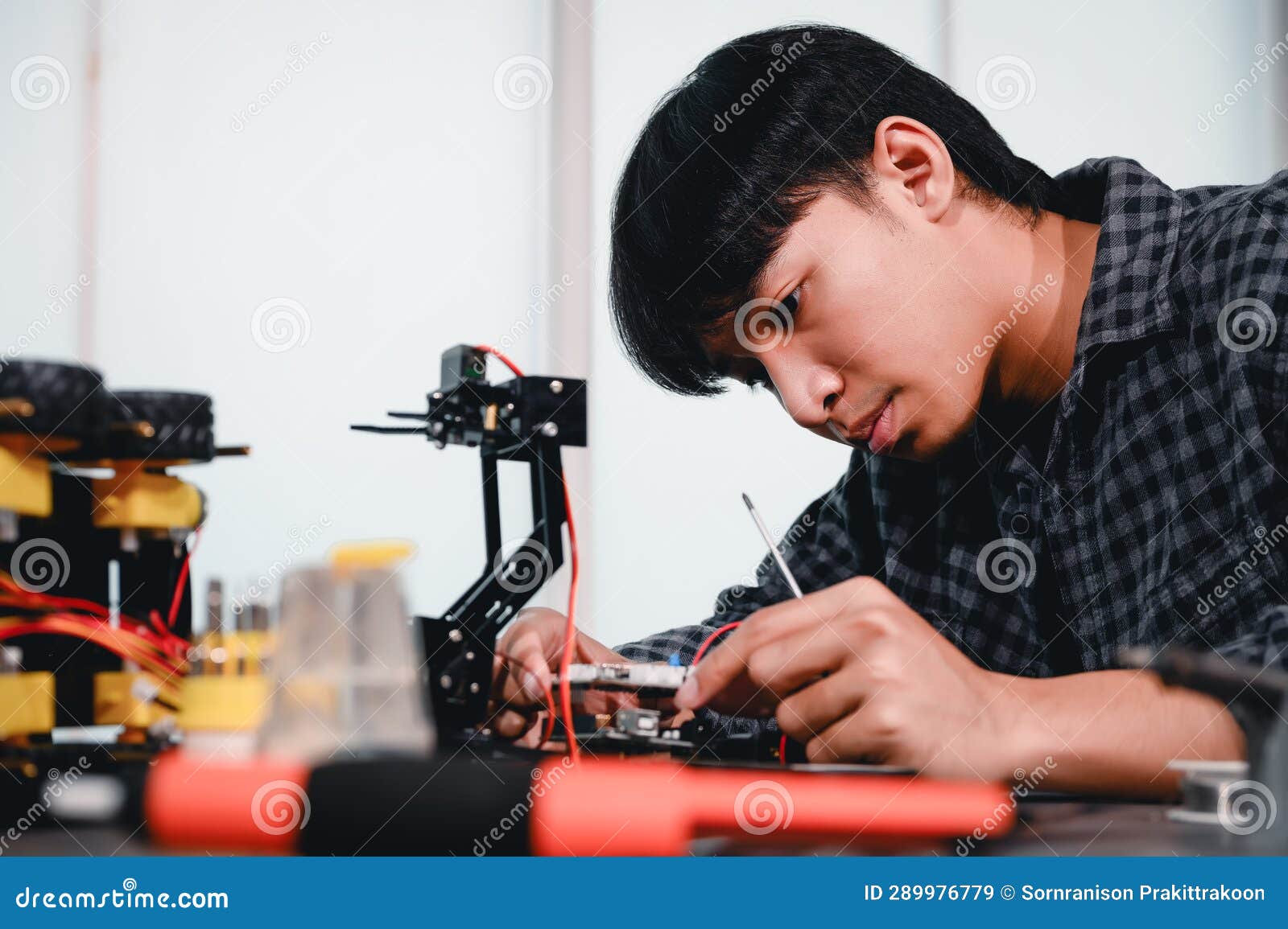 Engineer Asian Students Assembling Robotics Kits. Learning Mechanical Control, Robotics Combines ...