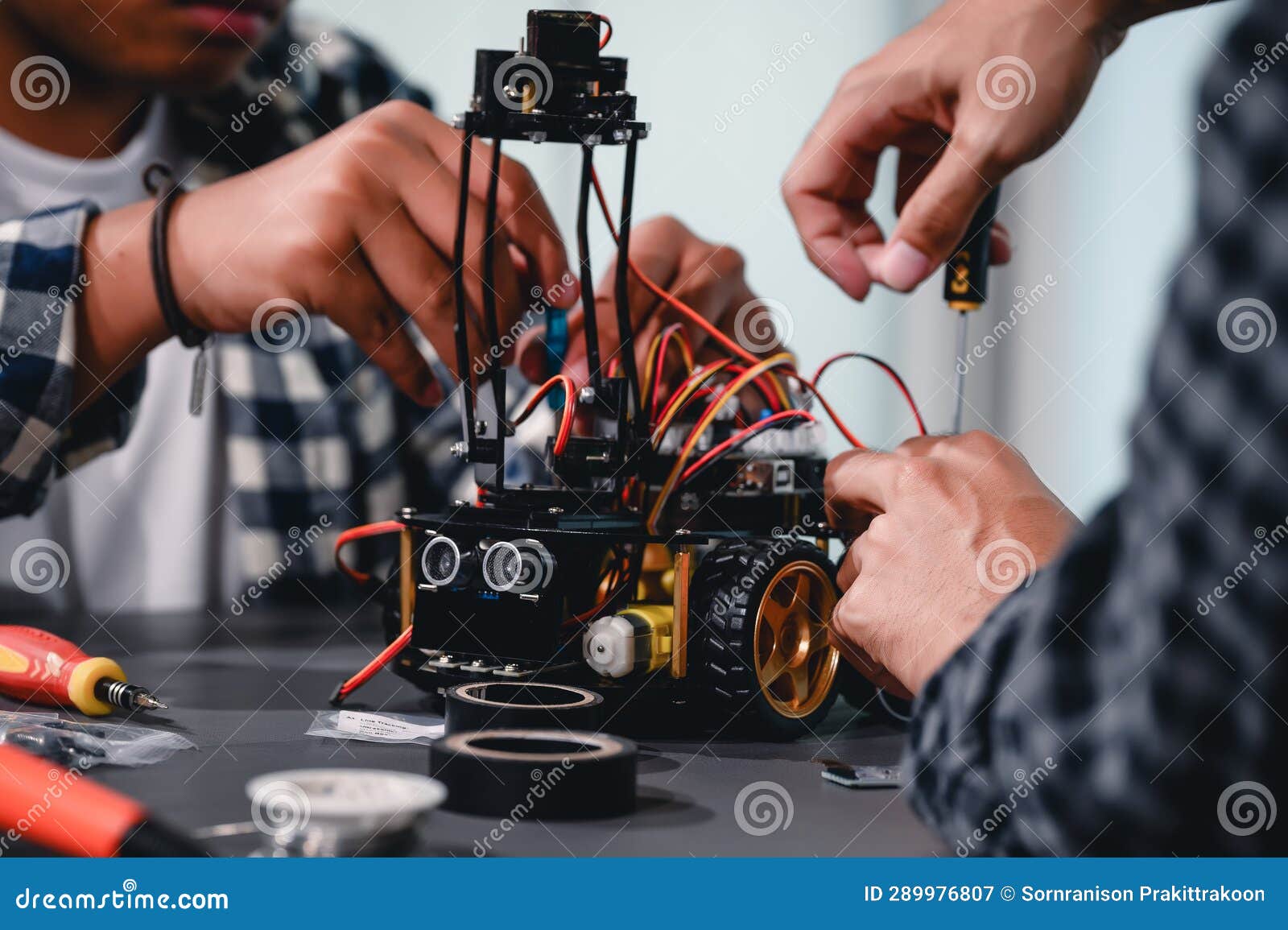 Engineer Asian Students Assembling Robotics Kits. Learning Mechanical Control, Robotics Combines ...