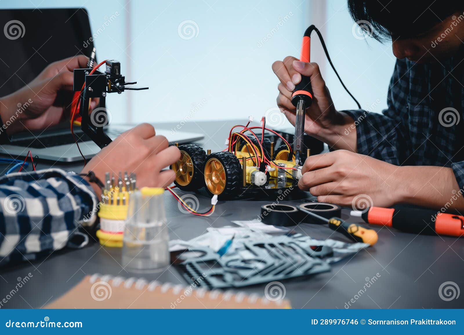 Engineer Asian Students Assembling Robotics Kits. Learning Mechanical Control, Robotics Combines ...