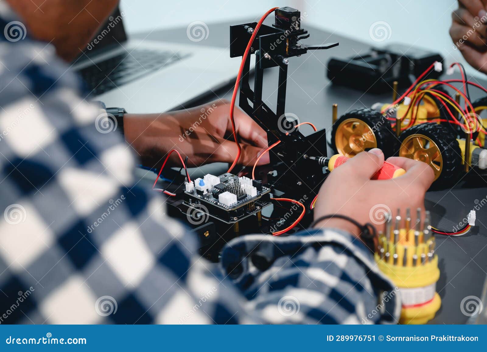 Engineer Asian Students Assembling Robotics Kits. Learning Mechanical Control, Robotics Combines ...