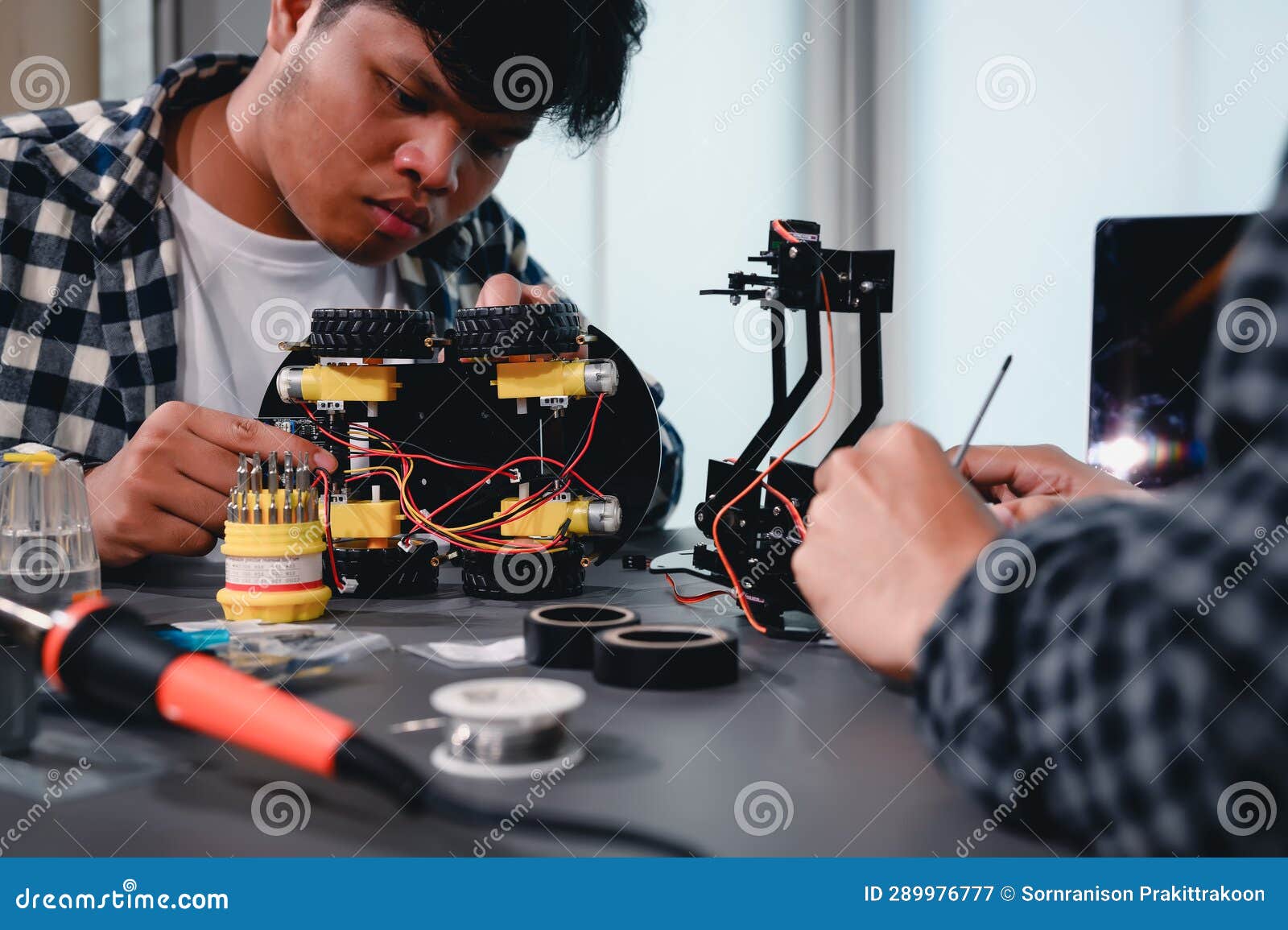 Engineer Asian Students Assembling Robotics Kits. Learning Mechanical Control, Robotics Combines ...