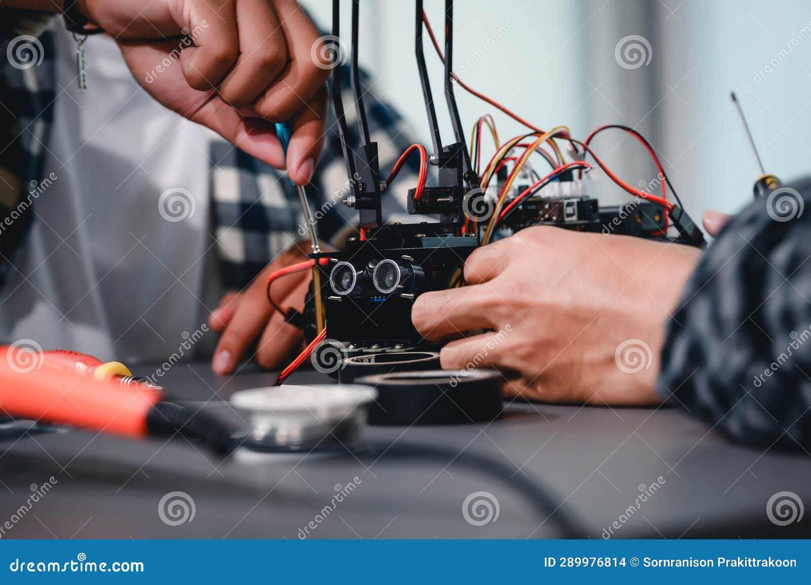 Engineer Asian Students Assembling Robotics Kits. Learning Mechanical Control, Robotics Combines ...