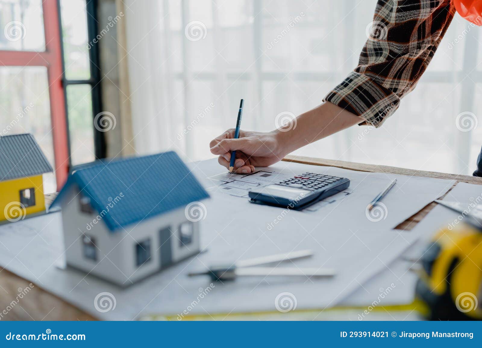 Engineer Brainstorming and Measuring for Cost Estimating on Blueprint ...