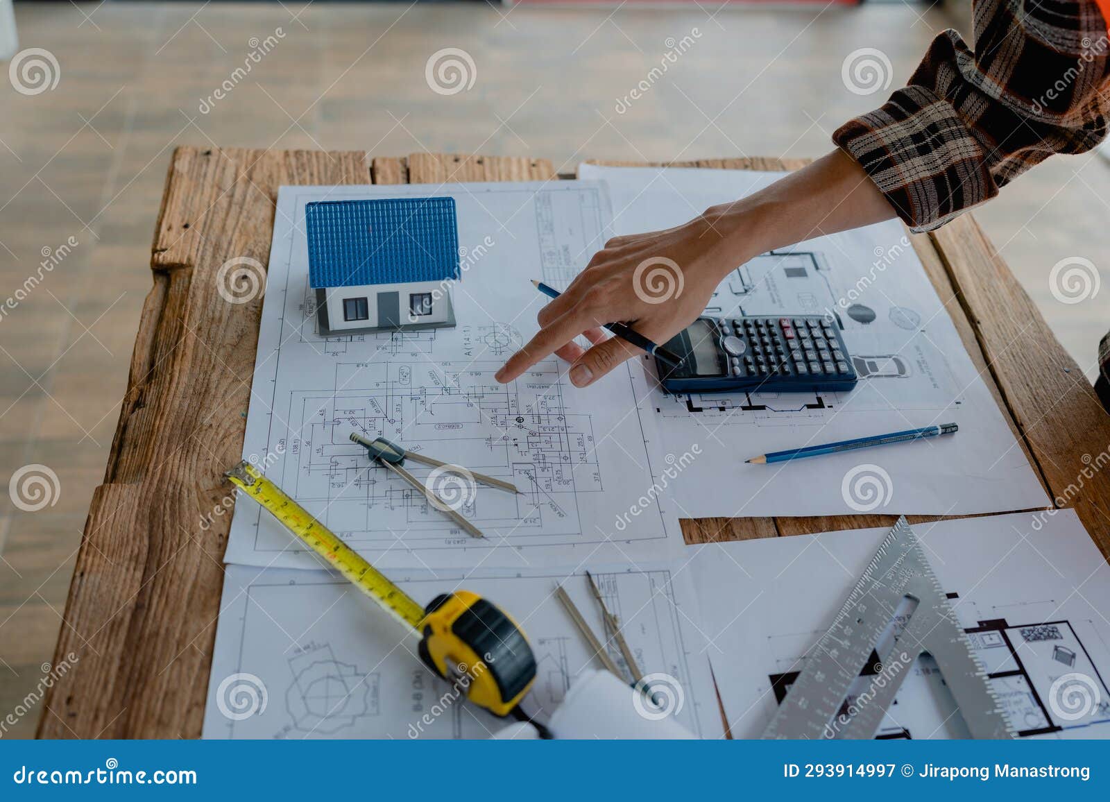 Engineer Brainstorming And Measuring For Cost Estimating On Blueprint ...