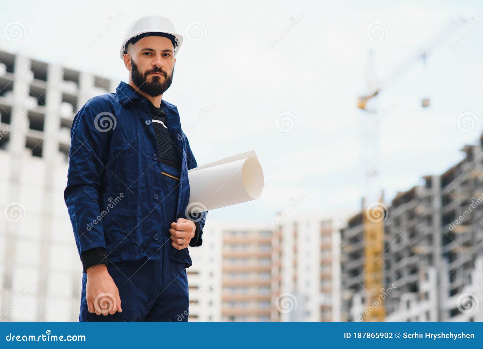 Engineer Builder Wearing Safety Vest with Blueprint at Construction ...