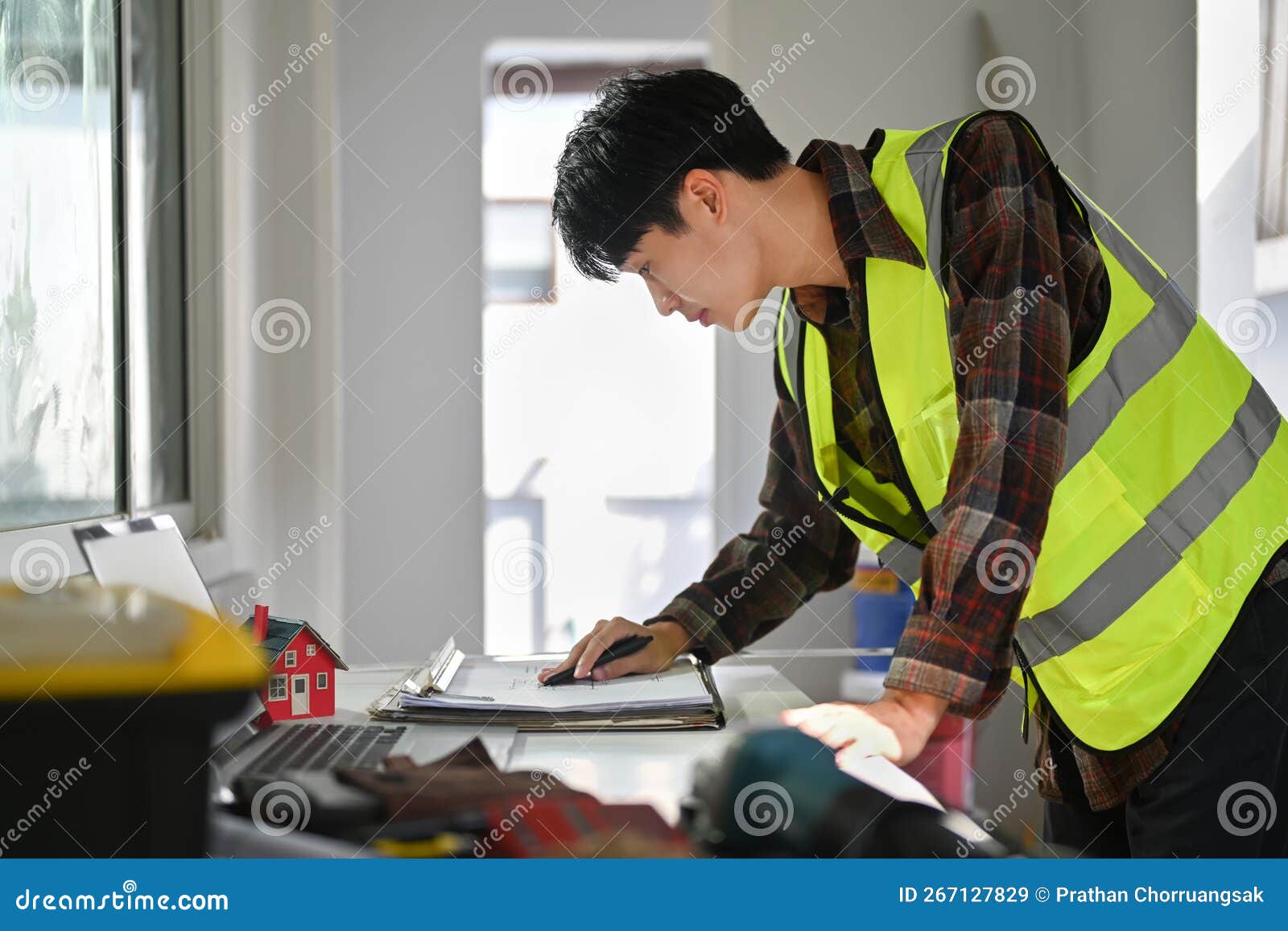 Engineer or Building Inspector in Yellow Vest Checking and Inspecting ...
