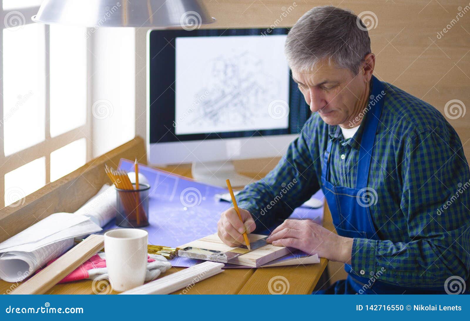 Engineer Carpenter Working on Laptop and Sketching Project Stock Photo ...