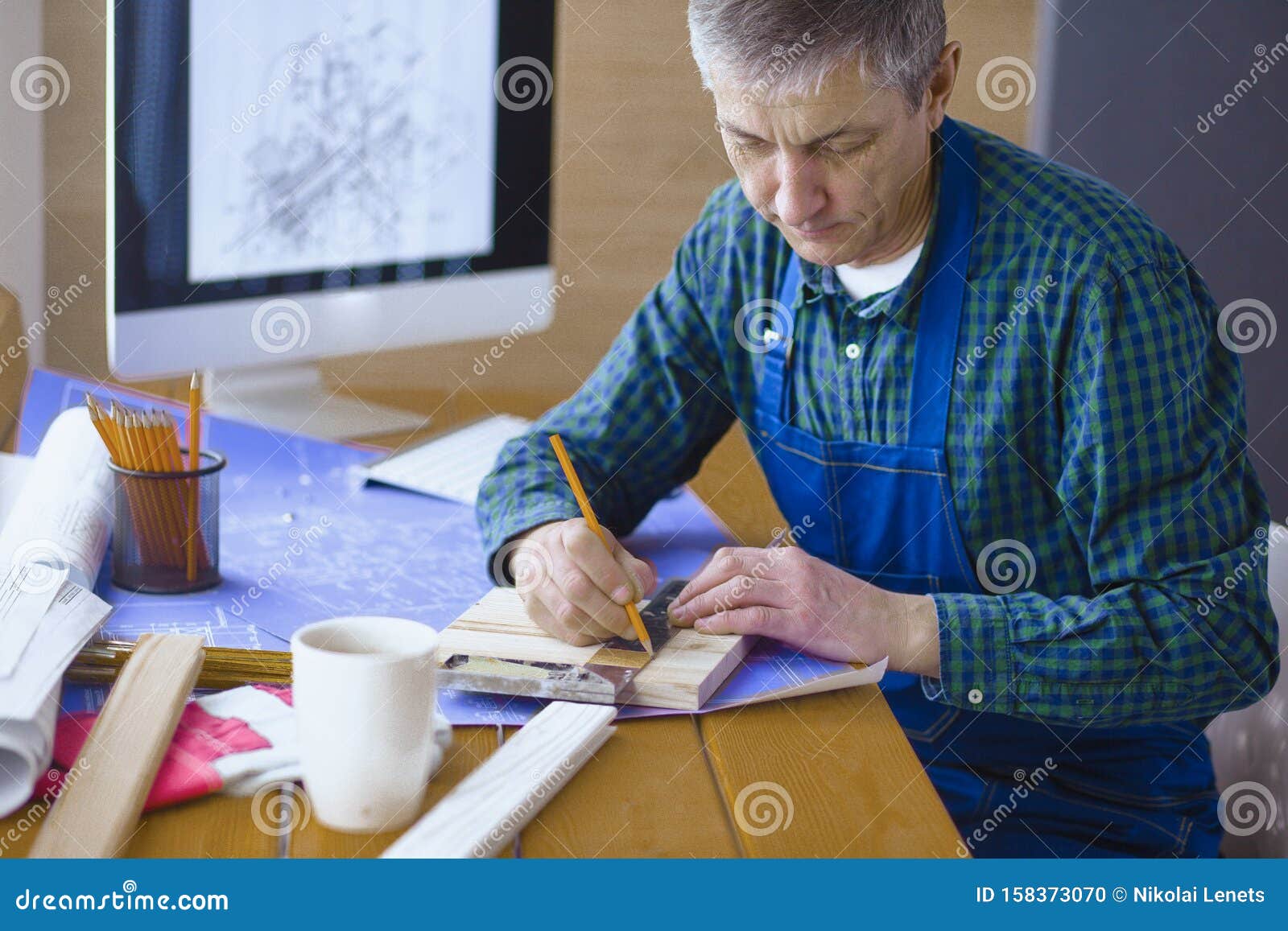 Engineer Carpenter Working on Laptop and Sketching Project Stock Photo ...