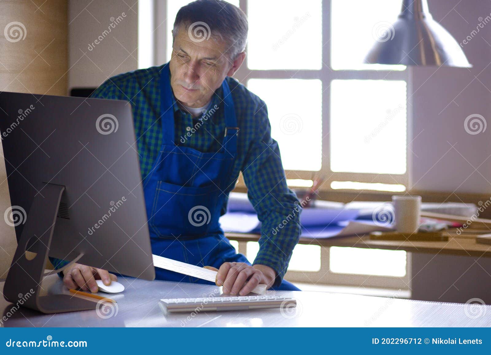 Engineer Carpenter Working on Laptop and Sketching Project Stock Photo ...