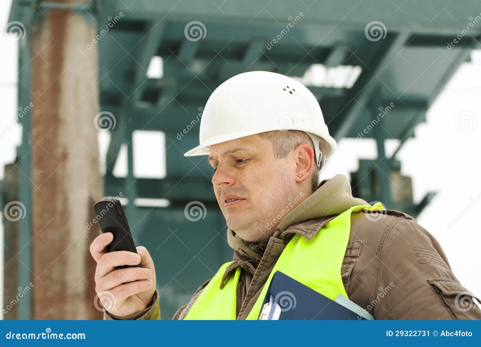 Engineer with cell phone stock image. Image of cute, power - 29322731