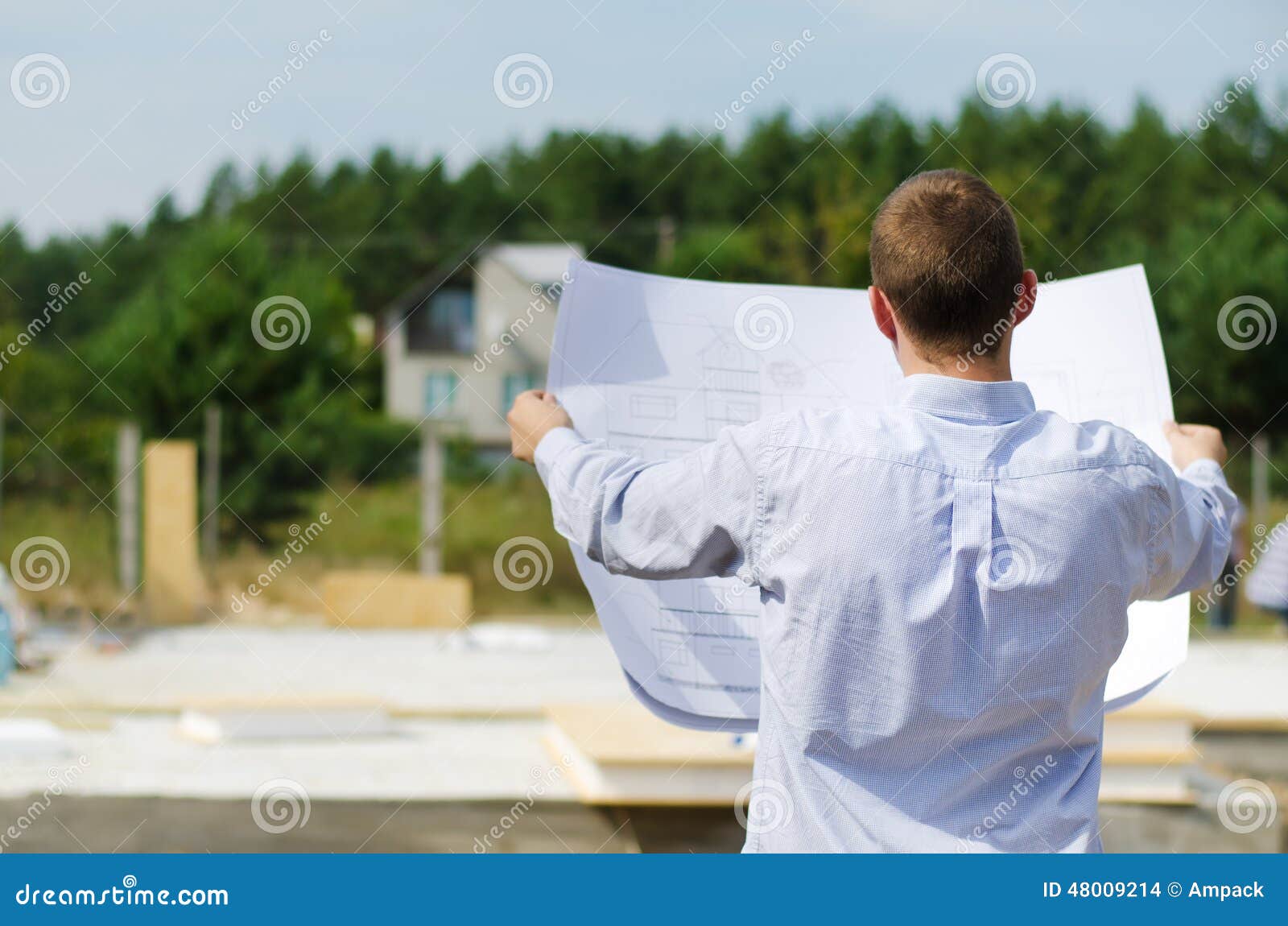 Engineer Checking a Building Plan on Site Stock Photo - Image of ...