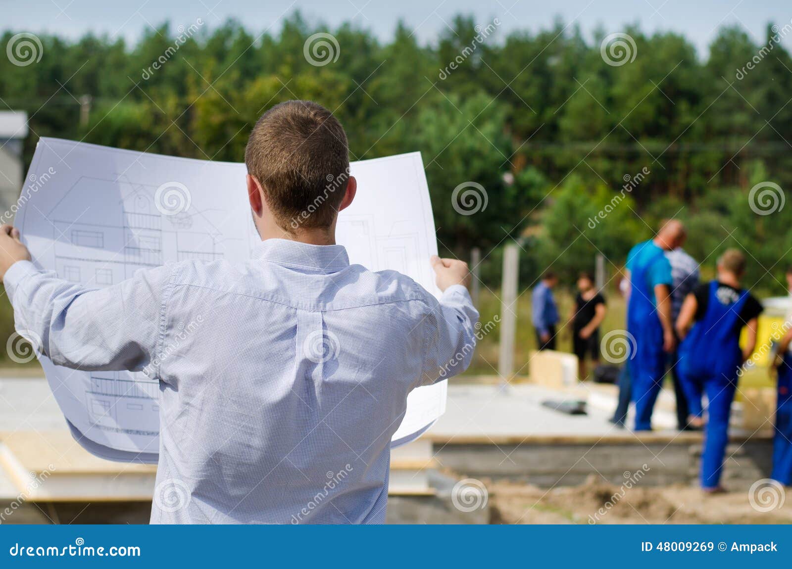 Engineer Checking a Building Plan on Site Stock Image - Image of ...