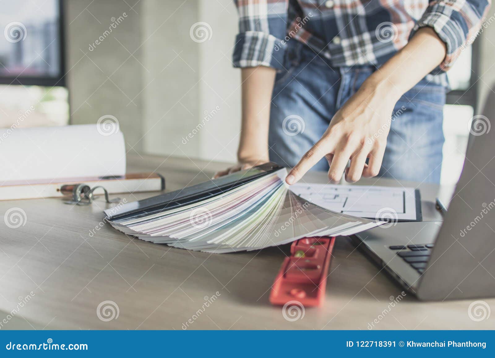 Engineer Checking Color in Coloring Chart and Looking on Laptop Stock ...
