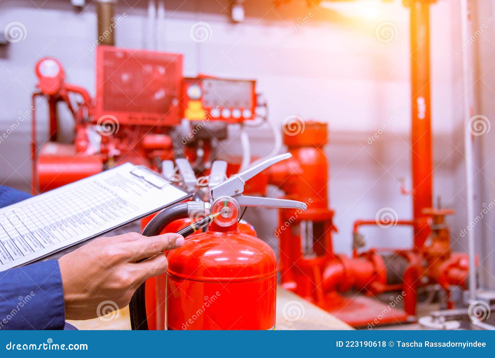 Firefighter Checking Pressure Gauge Level of Fire Extinguisher Tank in ...