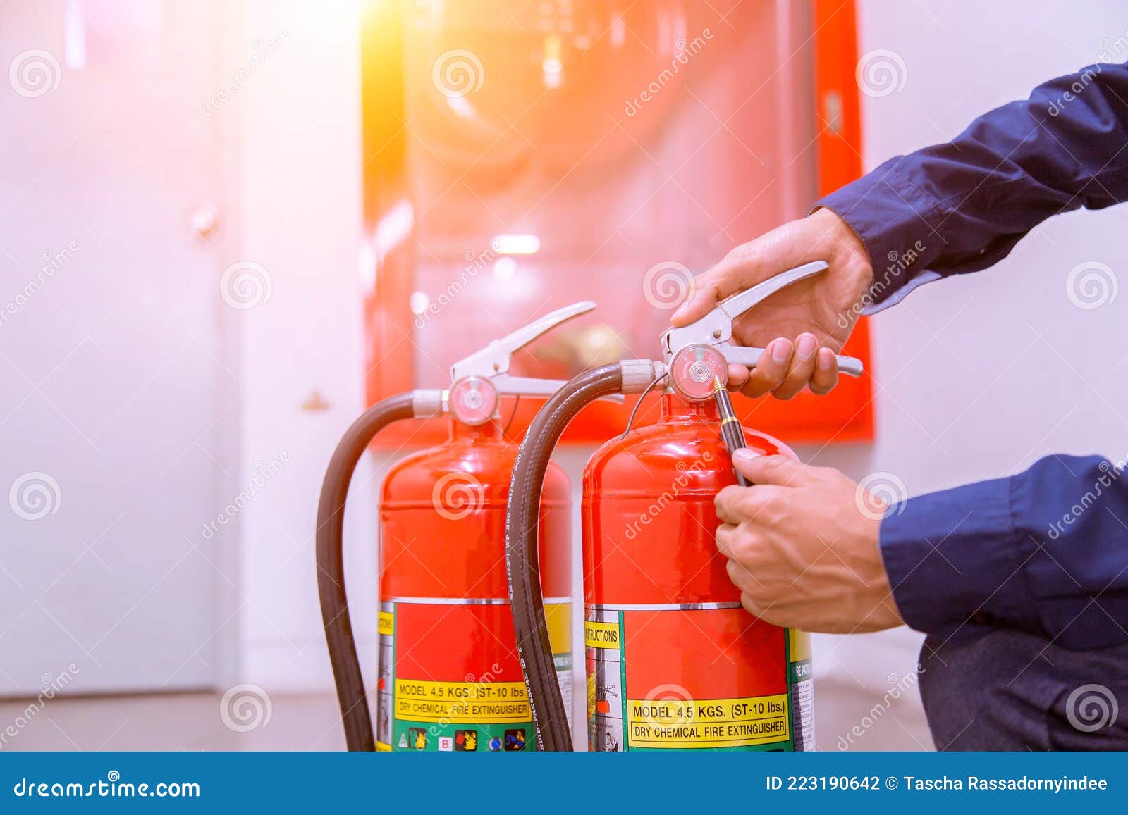 Firefighter Are Checking Fire Extinguishers Tank In The Building ...