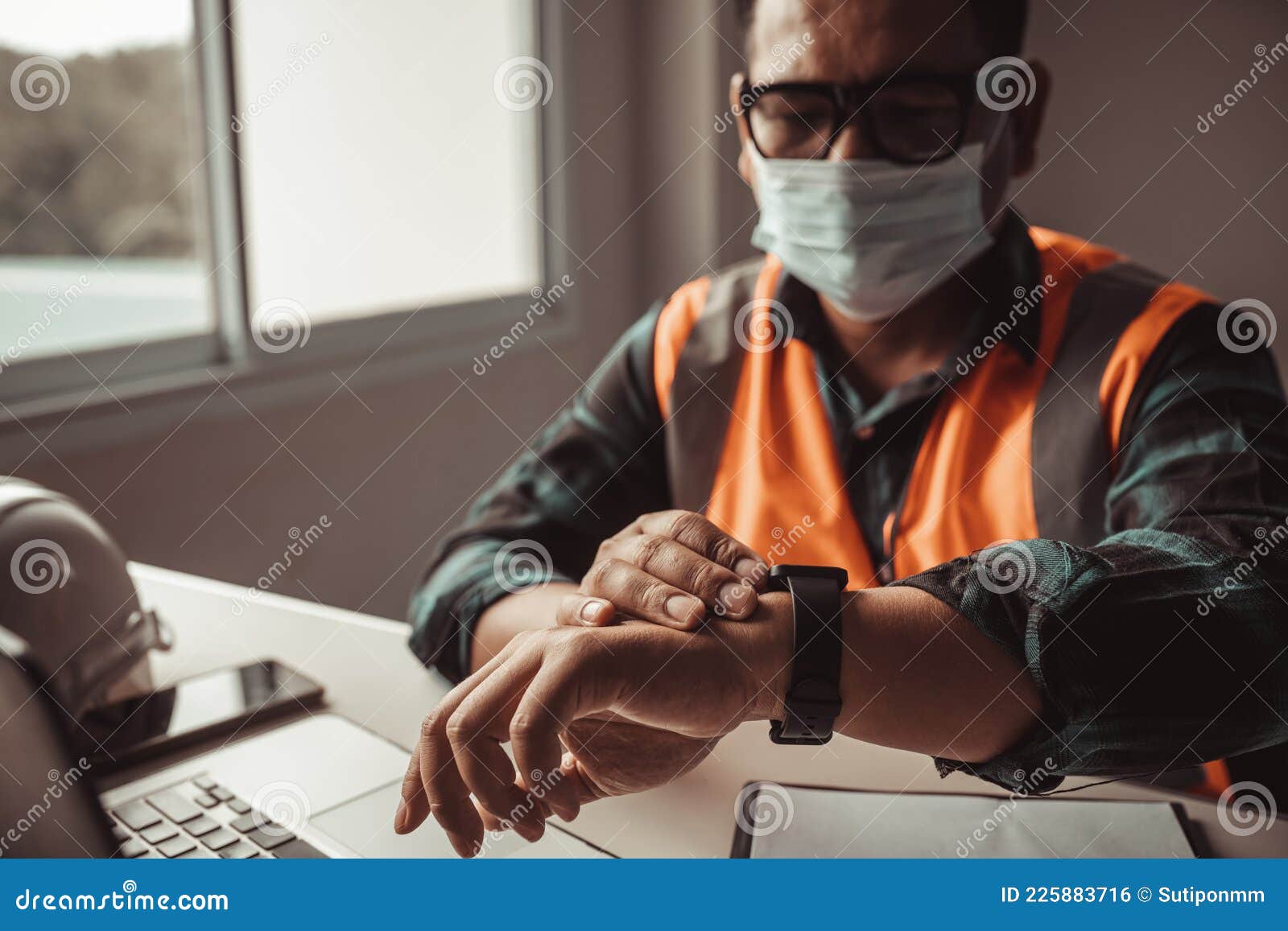 Engineer Checks the Time by Looking at a Smartwatch Stock Photo - Image ...