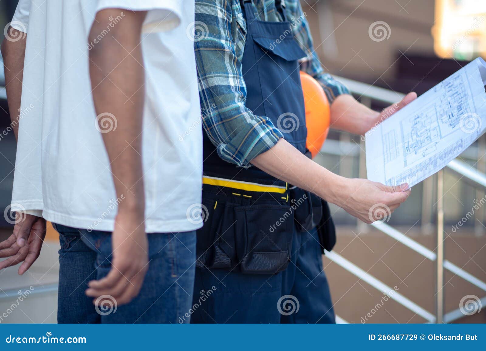 Engineer and a Client Studying a Residential Plumbing Plan Stock Image ...