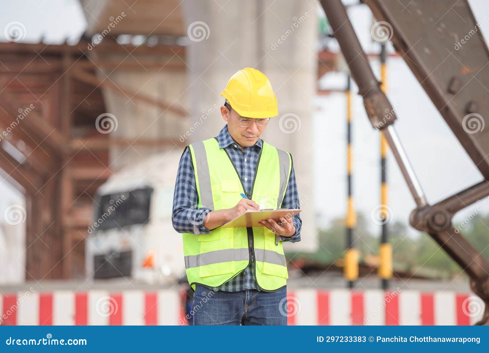 Engineer with Clipboard Checklist at Infrastructure Construction Site ...